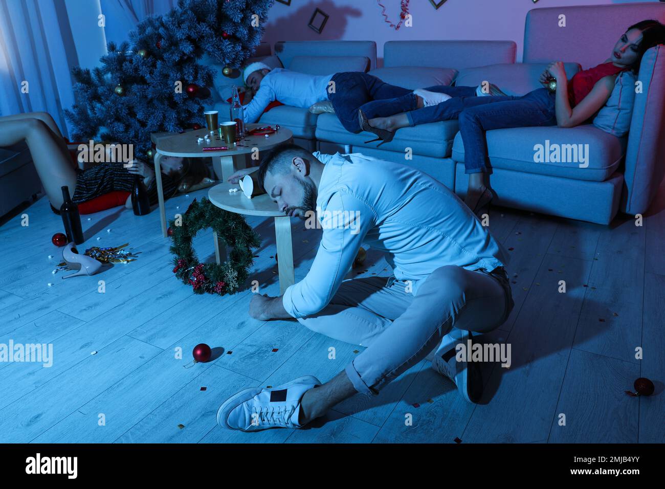 Friends sleeping in messy room after New Year party Stock Photo - Alamy