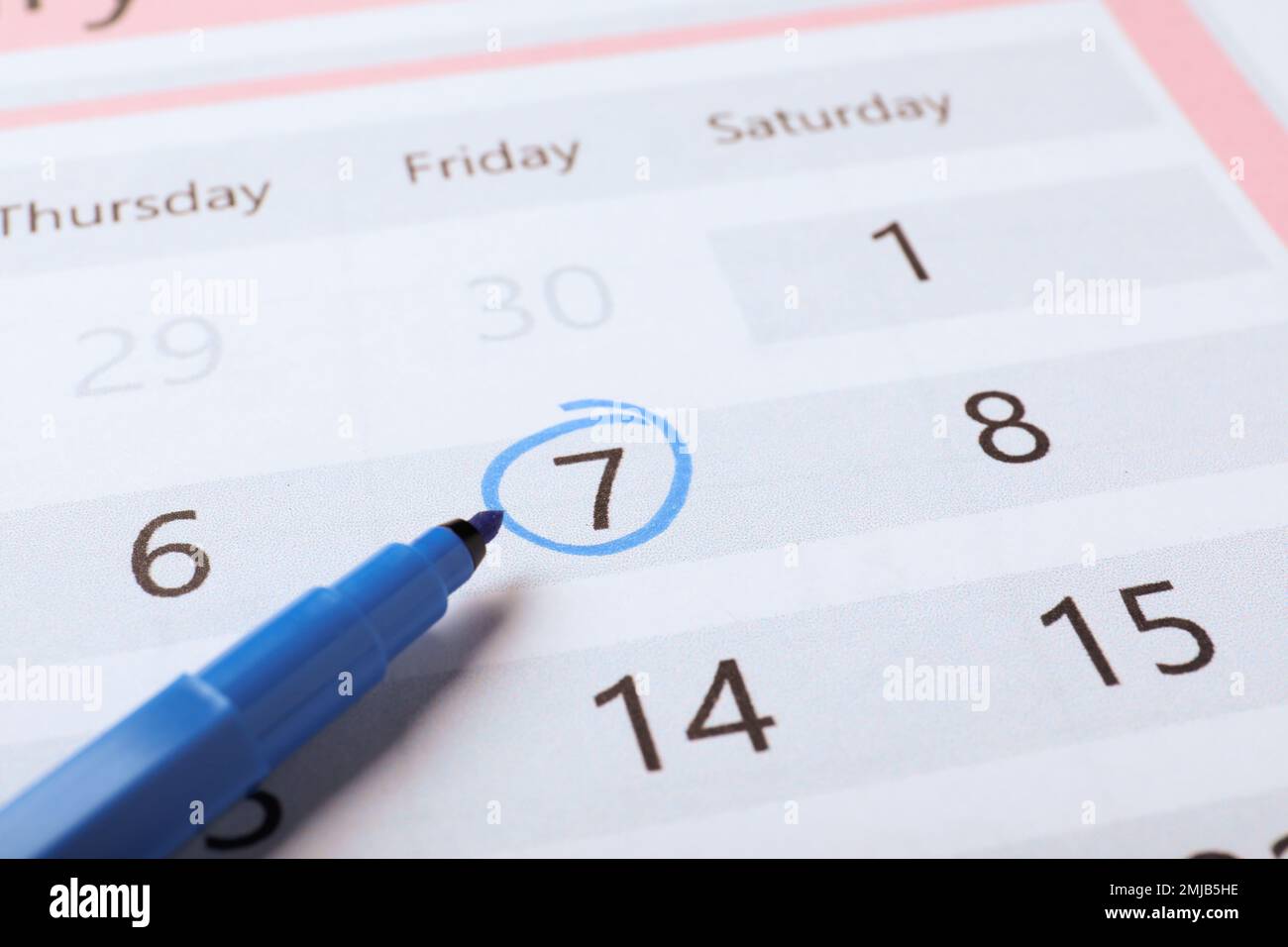 Felt pen on calendar page with marked date, closeup Stock Photo - Alamy