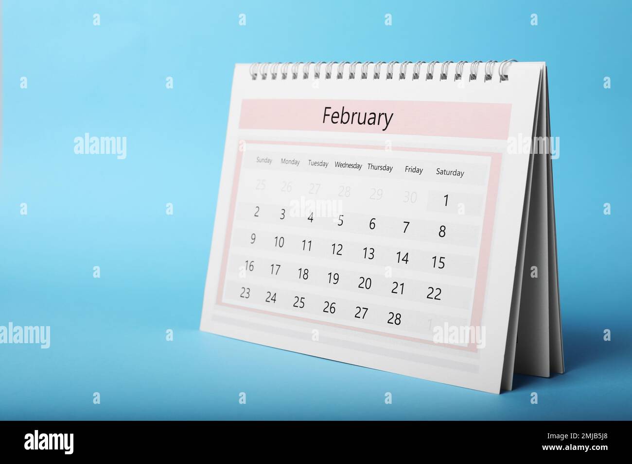 Paper calendar on light blue background. Planning concept Stock Photo ...