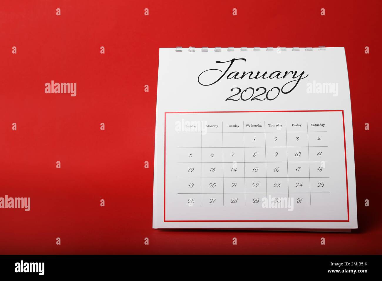 Paper calendar on red background. Planning concept Stock Photo - Alamy