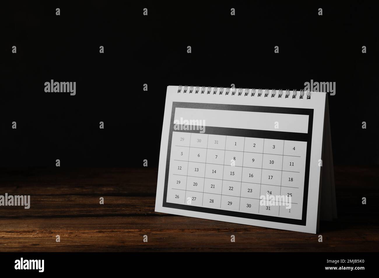 Paper calendar on wooden table, space for text. Planning concept Stock ...