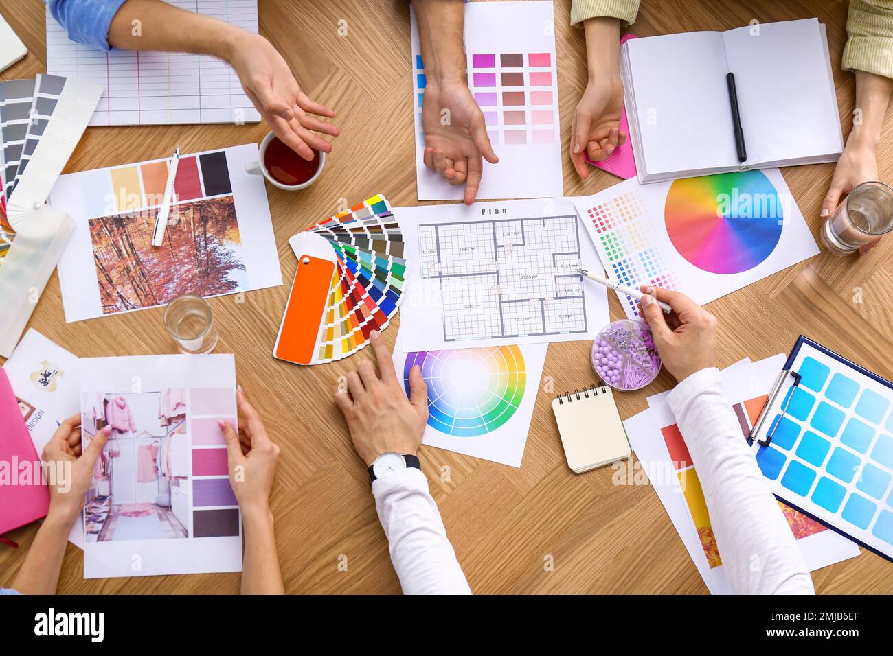 Professional team of interior designers working at table, top view ...