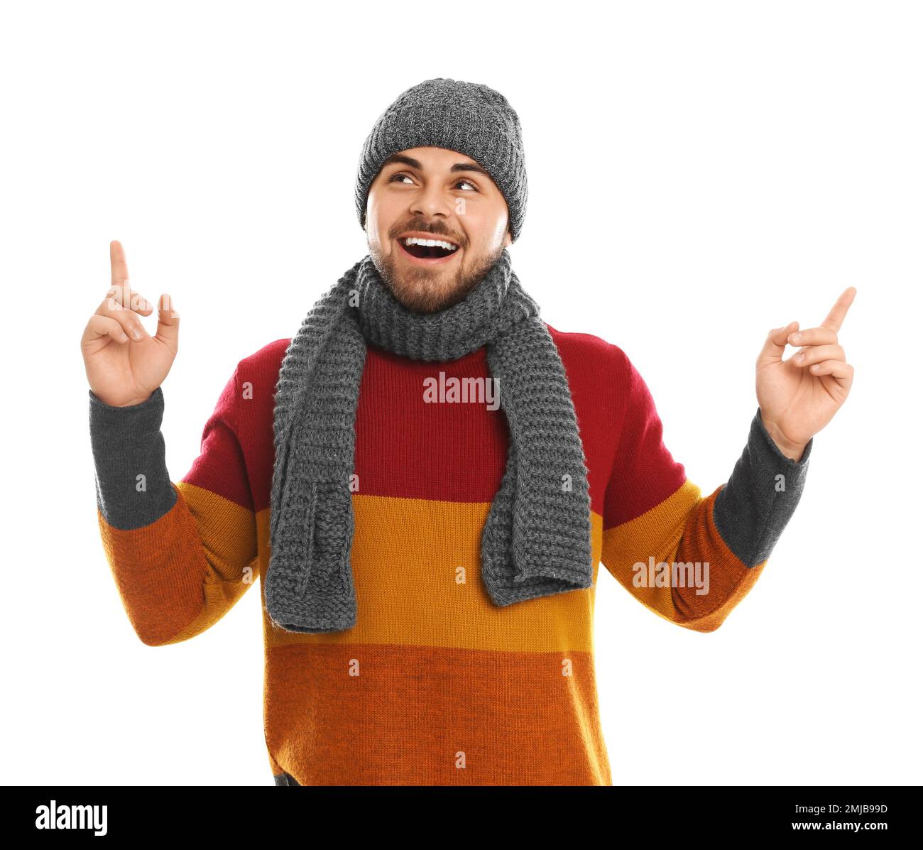 Emotional young man in warm clothes on white background. Winter ...