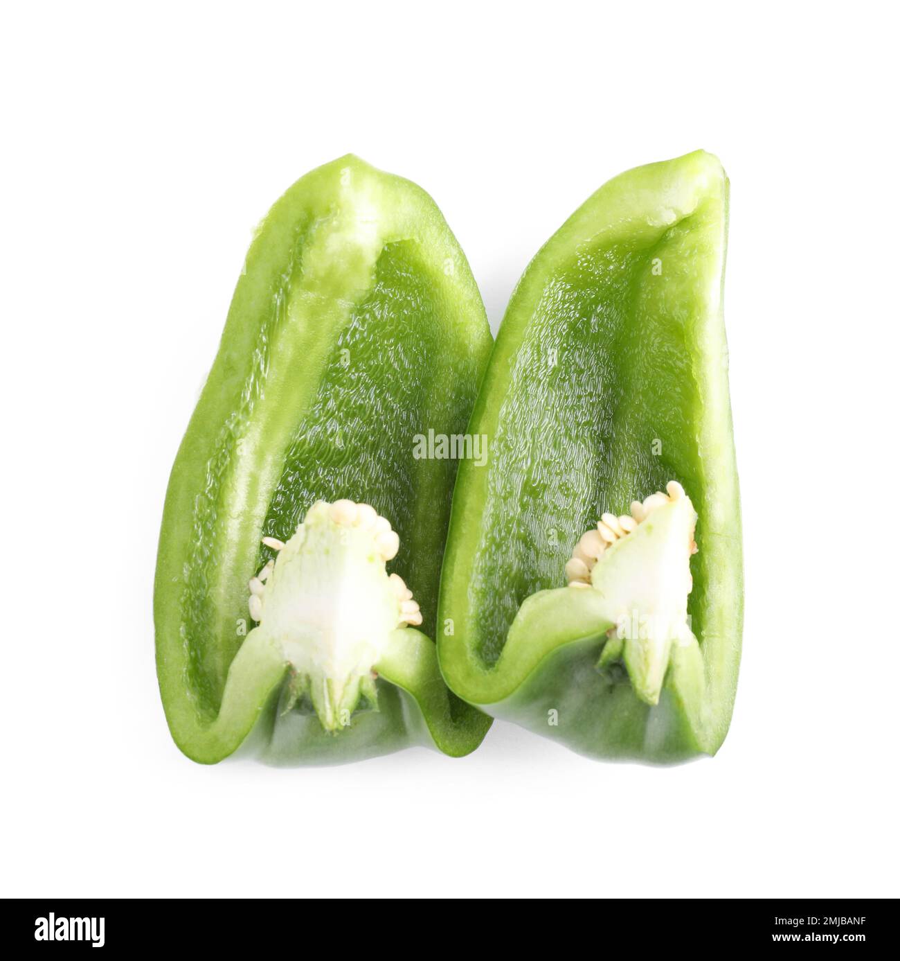 Cut green bell pepper isolated on white, top view Stock Photo - Alamy