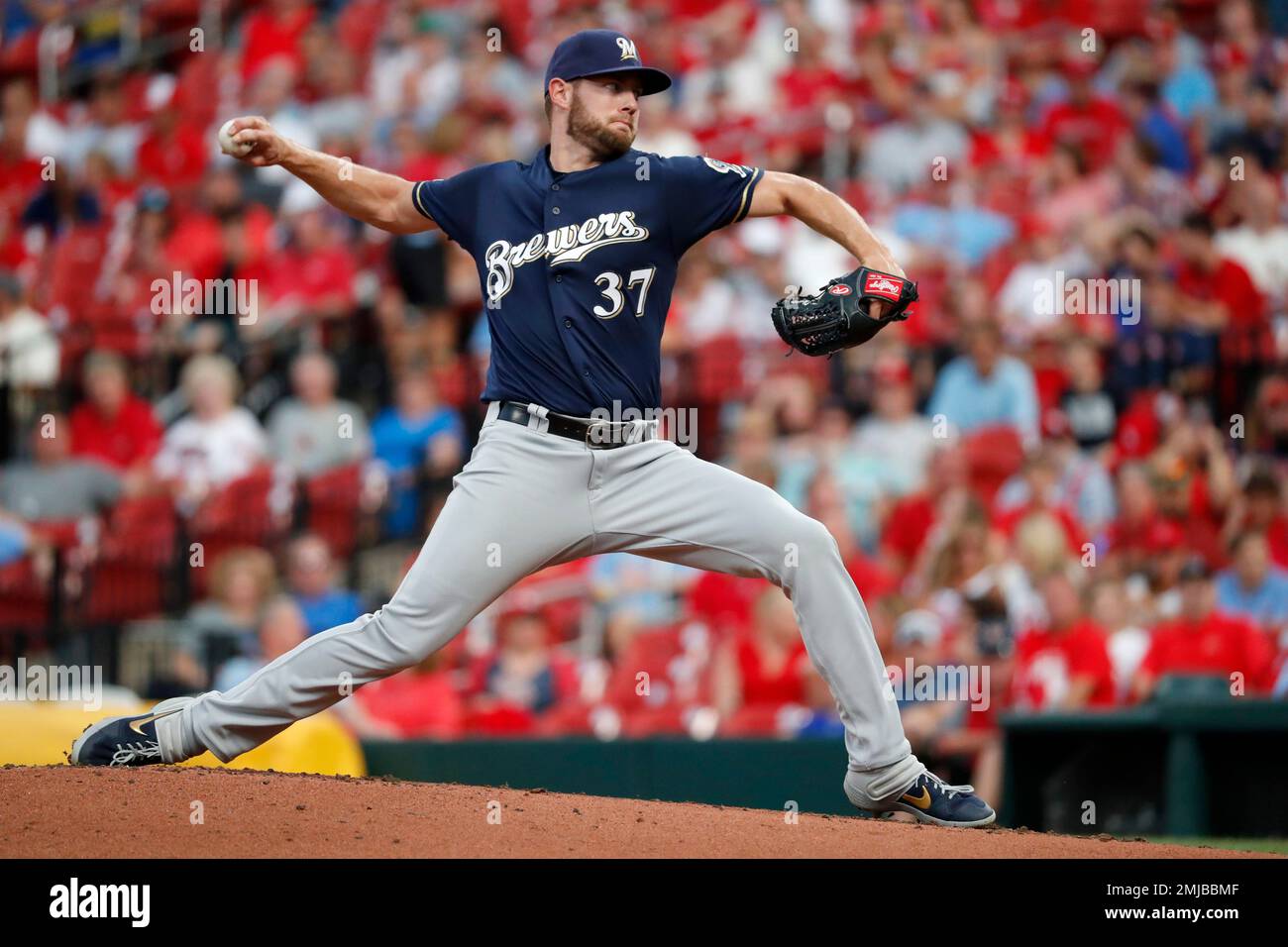 Milwaukee Brewers starting pitcher Adrian Houser throws during the ...