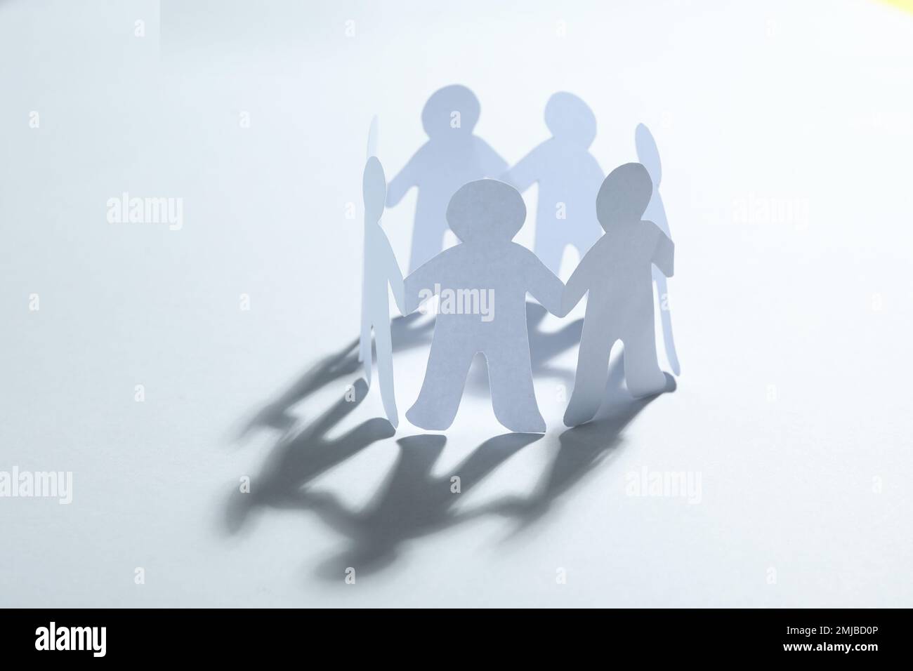 Paper people chain making circle on white background. Unity concept ...