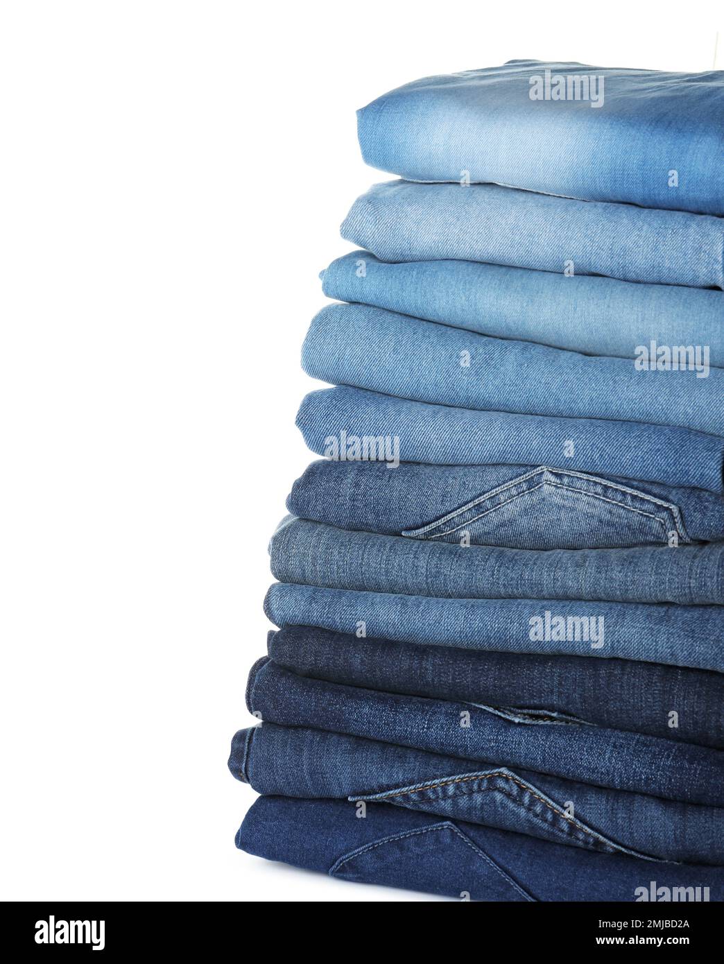 Stack of different jeans isolated on white Stock Photo - Alamy