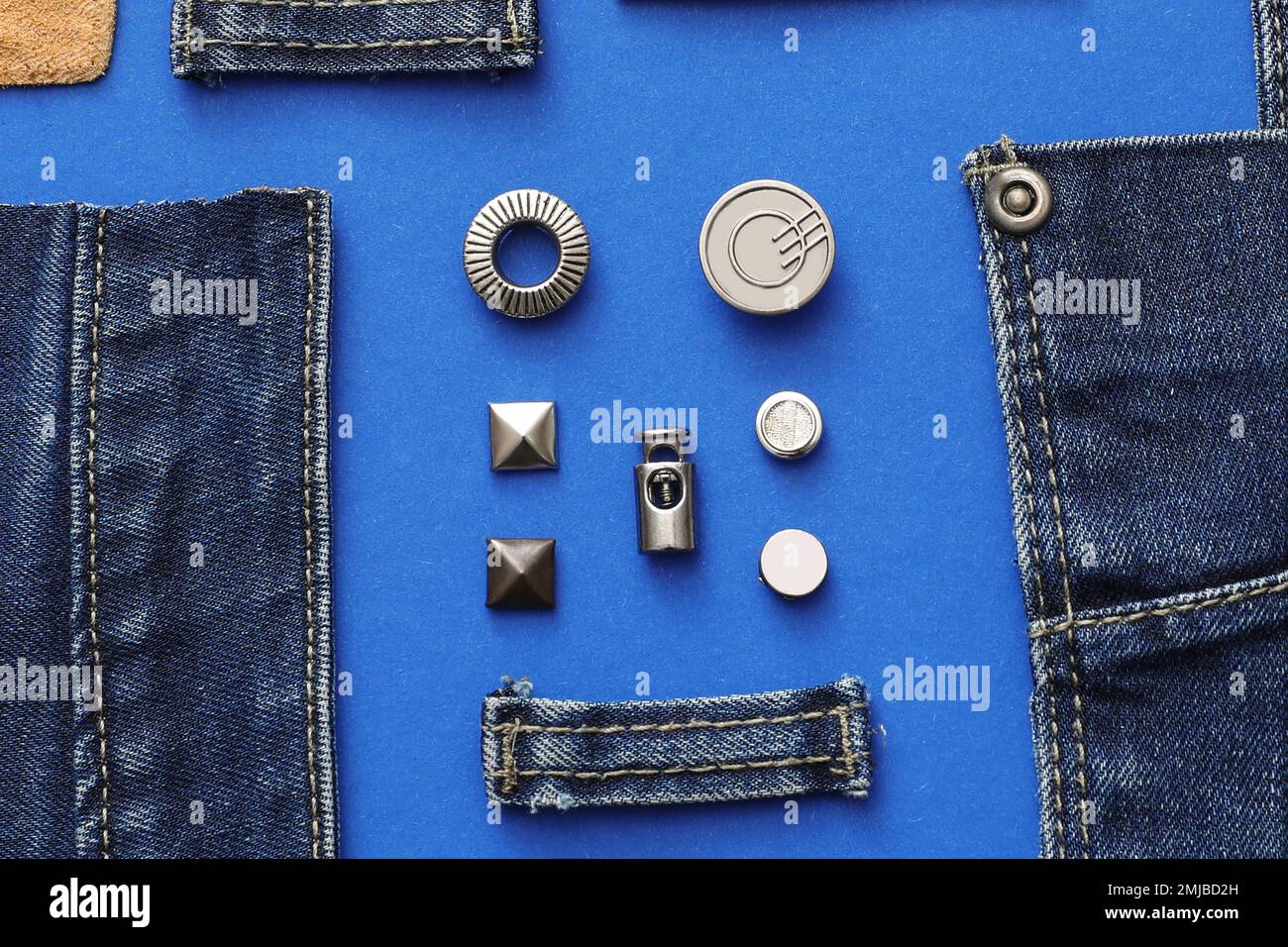 Flat lay composition with garment accessories and cutting details for ...