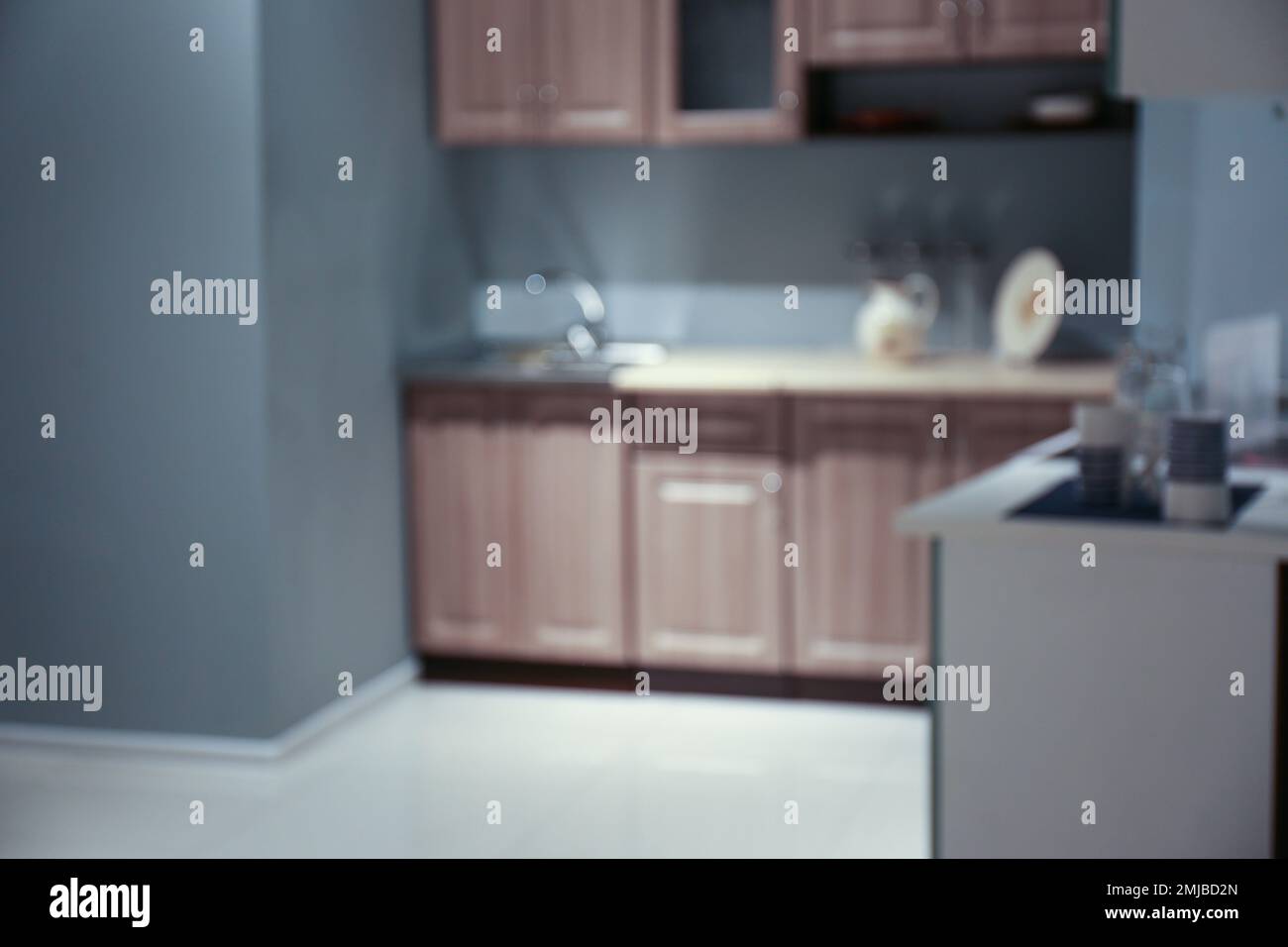 Blurred view of kitchen interior with modern furniture Stock Photo - Alamy