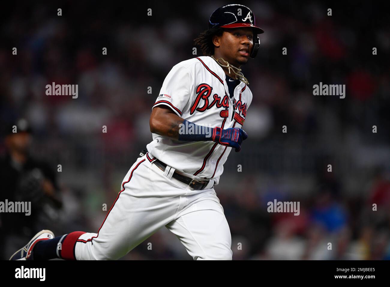Atlanta Braves' Ronald Acuna Jr. runs the first base line after batting ...