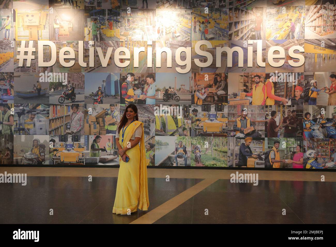 An Indian employee stands inside Amazon's newly inaugurated campus ...
