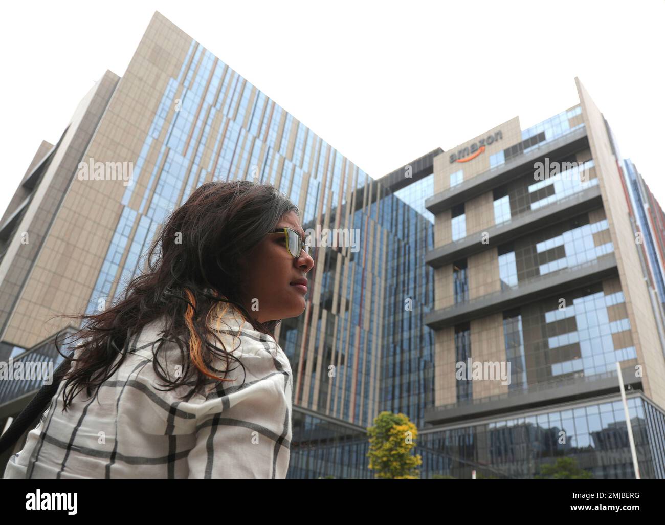An Indian employee walk in the premises of Amazon's newly inaugurated ...