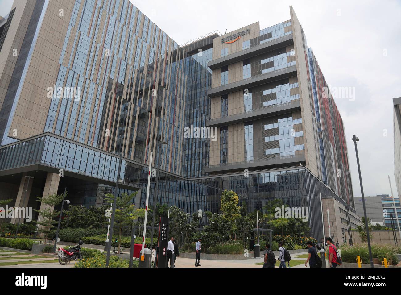 Indian employees walk in the premises of Amazon's newly inaugurated ...