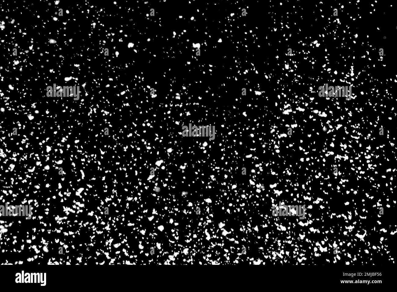 White snow falling down on black background Stock Photo - Alamy