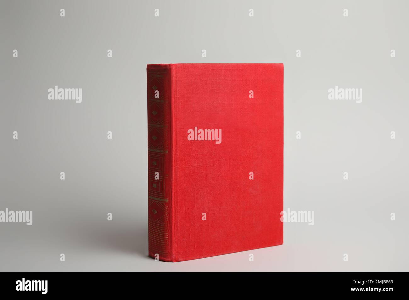 Hardcover book on light grey background. Space for design Stock Photo ...