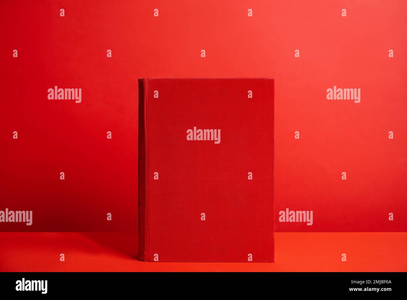 Hardcover book on red background. Space for design Stock Photo - Alamy