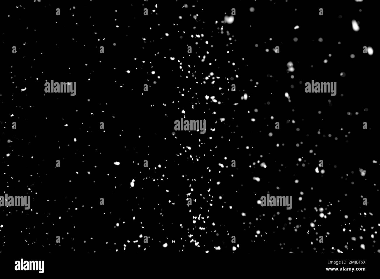 White snow falling down on black background Stock Photo - Alamy