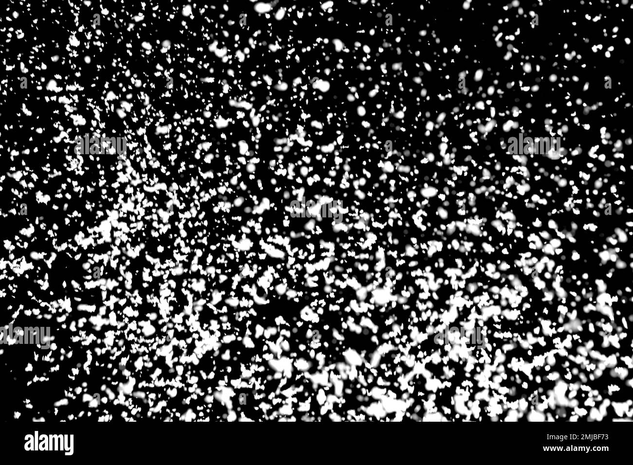 White snow falling down on black background Stock Photo - Alamy