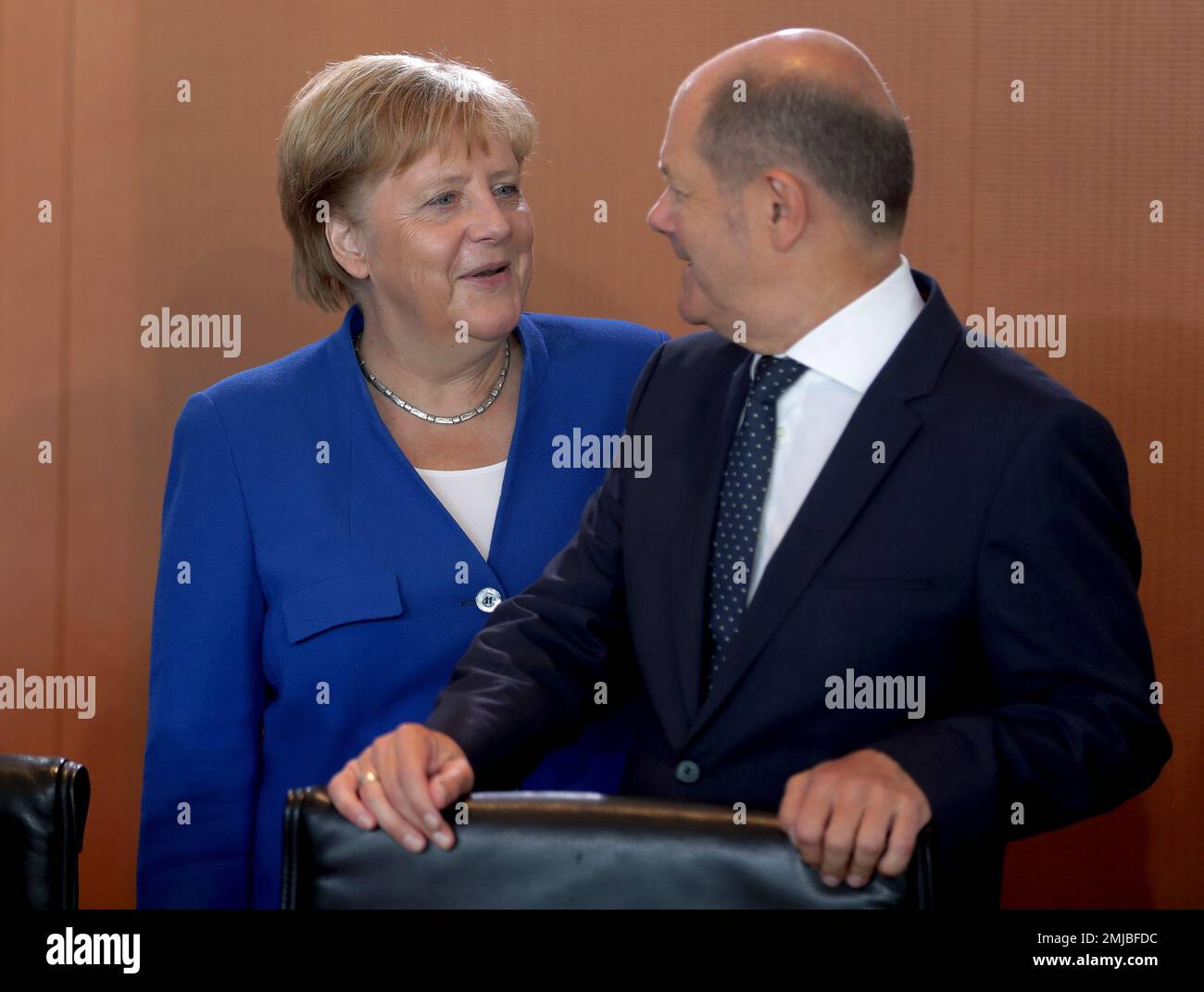German Chancellor Angela Merkel, right, and German Finance Minister ...