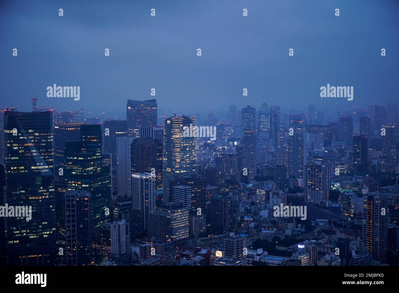 Tokyo's skyline is seen from the rooftop observation deck of Roppongi ...