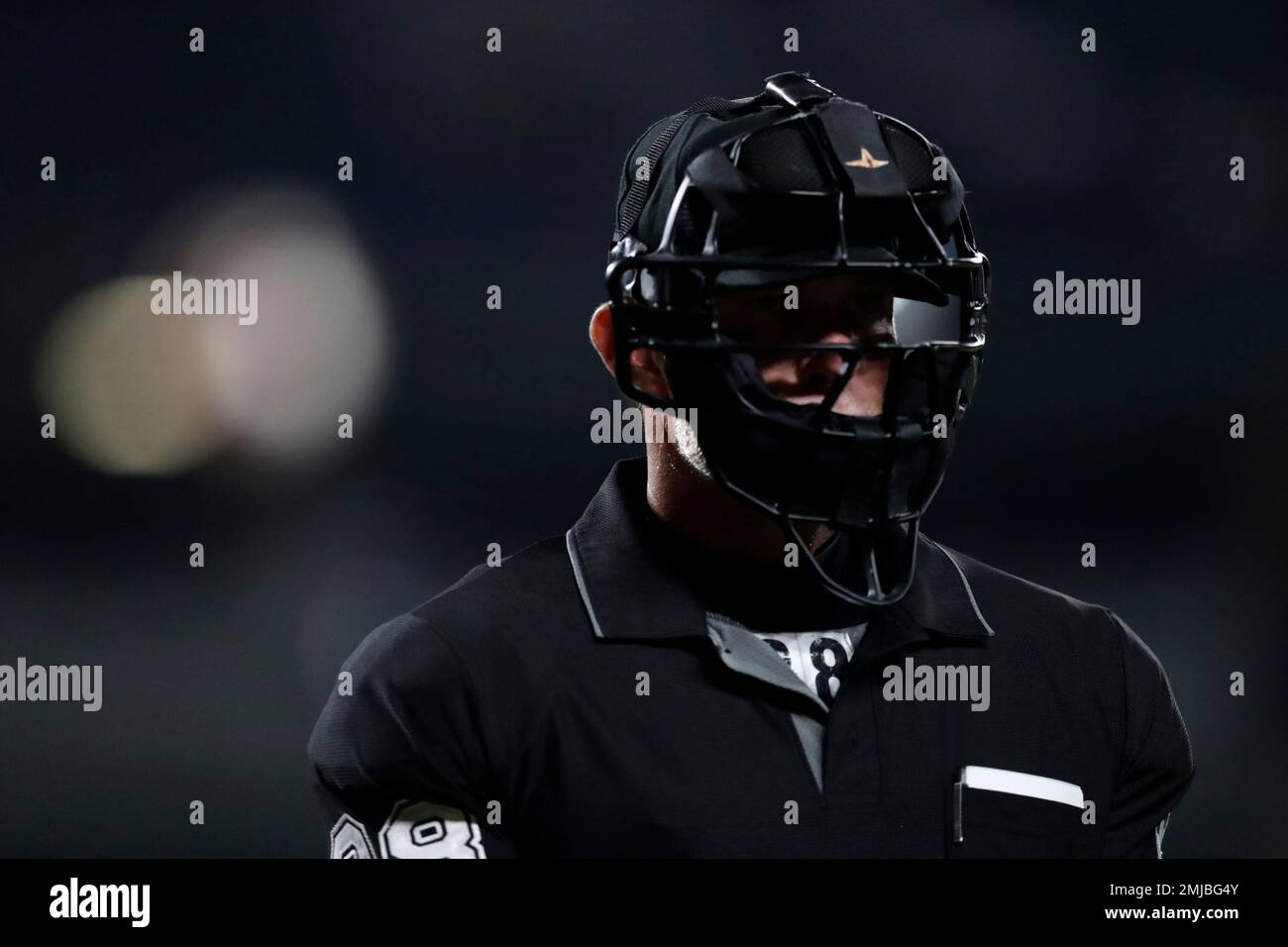 Home plate umpire Jim Wolf looks on during the eighth inning of a ...