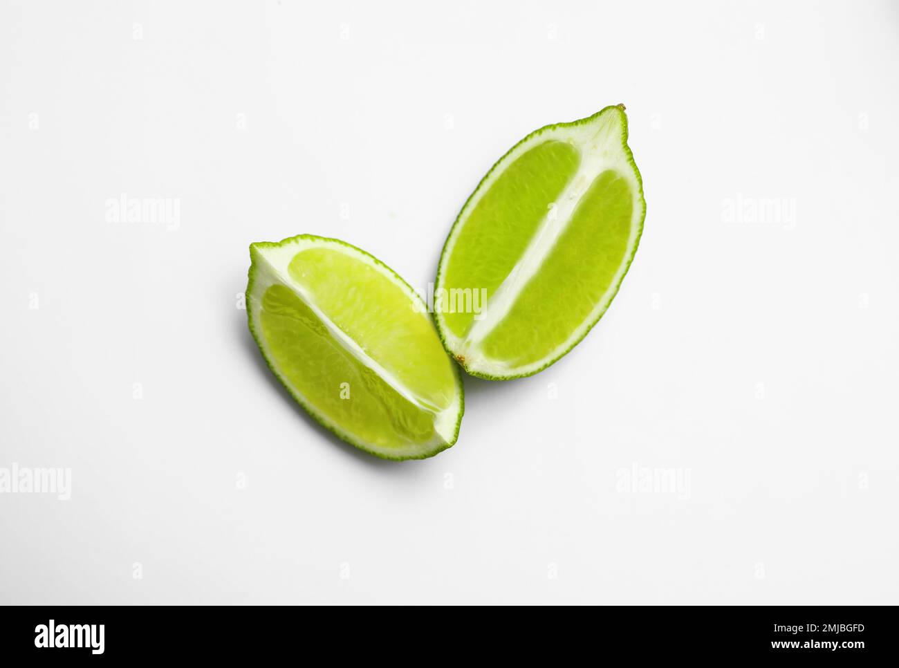 Cut fresh juicy lime on white background, top view Stock Photo - Alamy