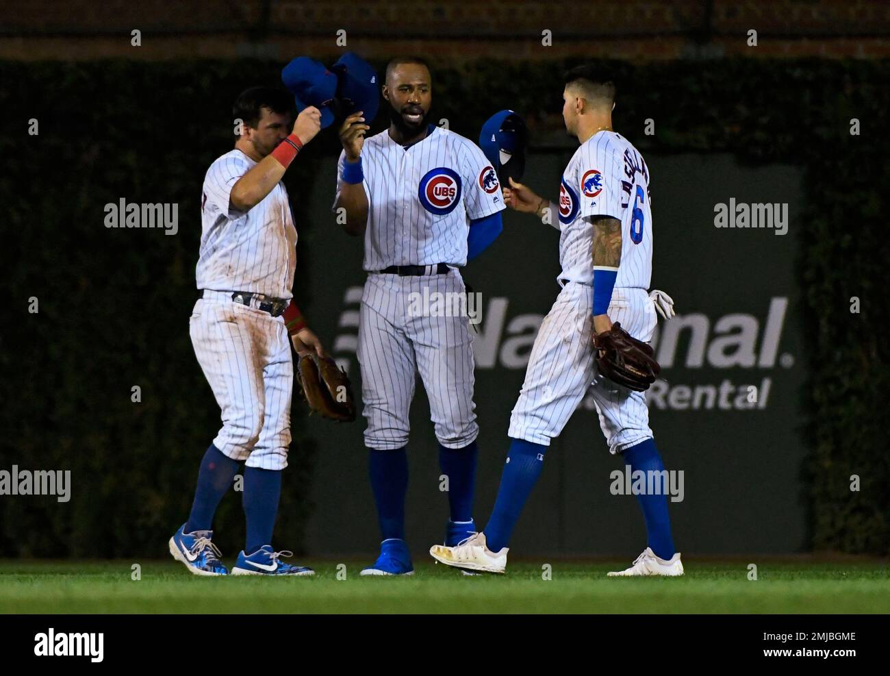 Chicago Cubs left fielder Kyle Schwarber, left, right fielder Jason ...