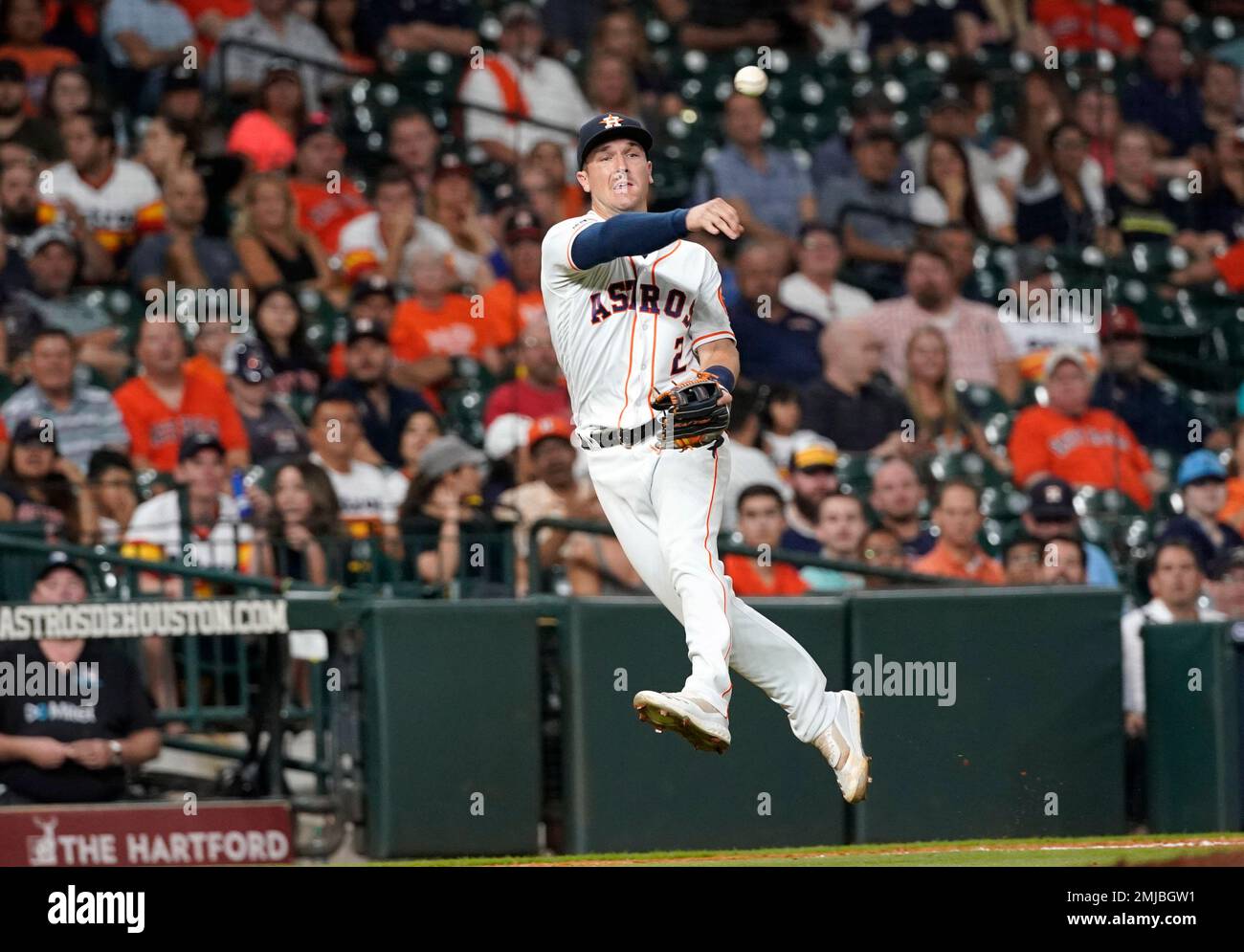 Houston Astros third baseman Alex Bregman throws to first after ...