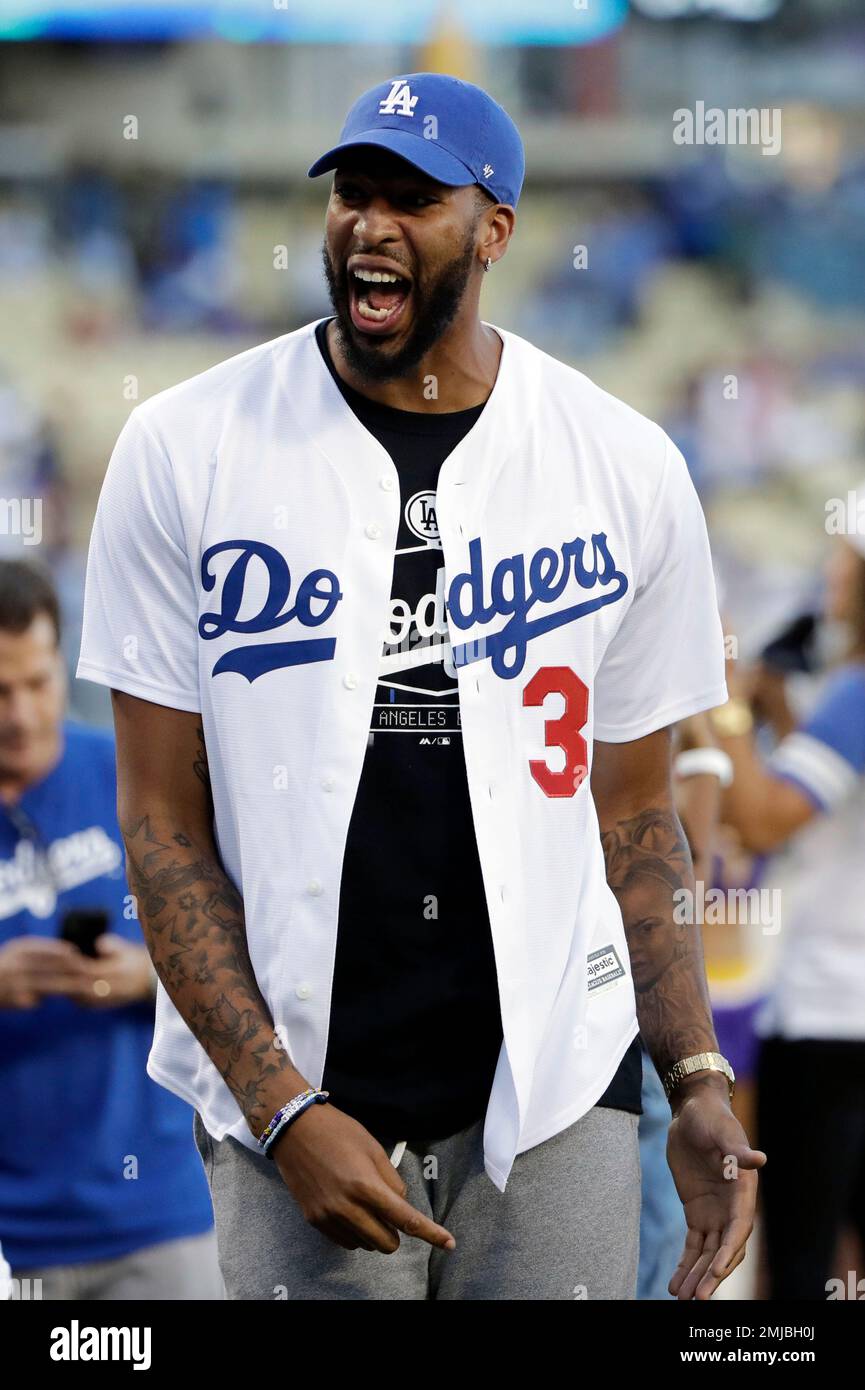 Los Angeles Lakers' Anthony Davis smiles before throwing the ceremonial ...