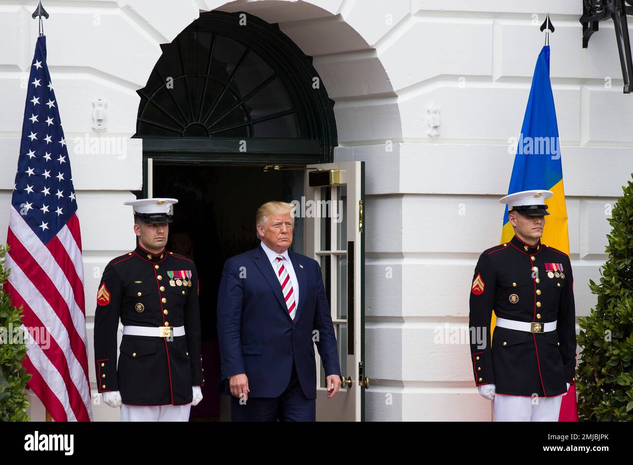 President Donald Trump arrives to greet Romanian President Klaus ...