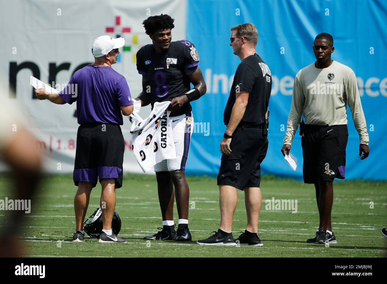 Baltimore Ravens quarterback Lamar Jackson (8) stands on the sidelines ...