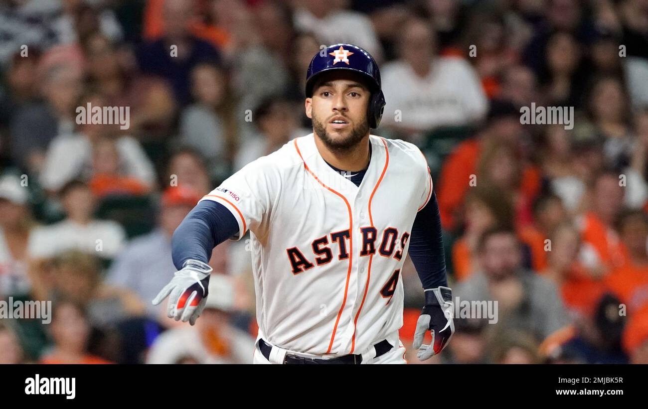 Houston Astros' George Springer tosses his bat after walking against ...