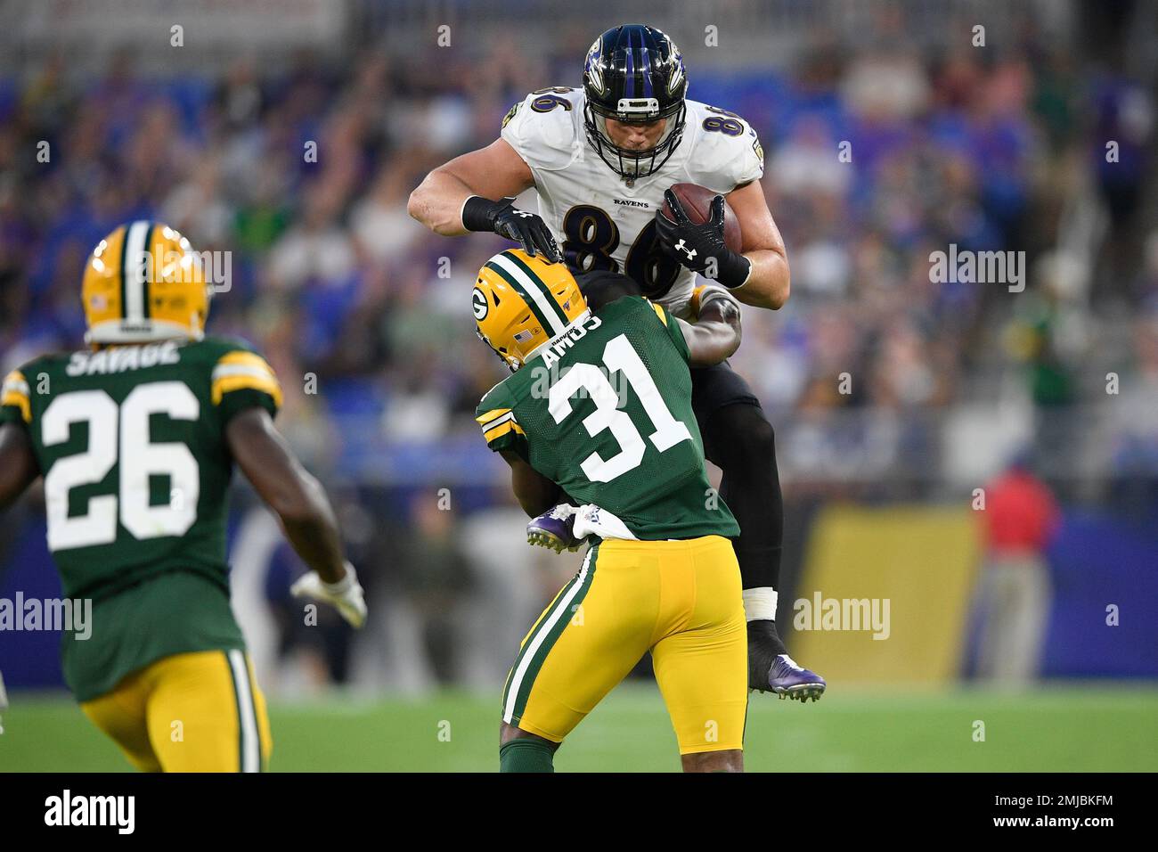 Baltimore Ravens tight end Nick Boyle, top, is stopped while trying to ...