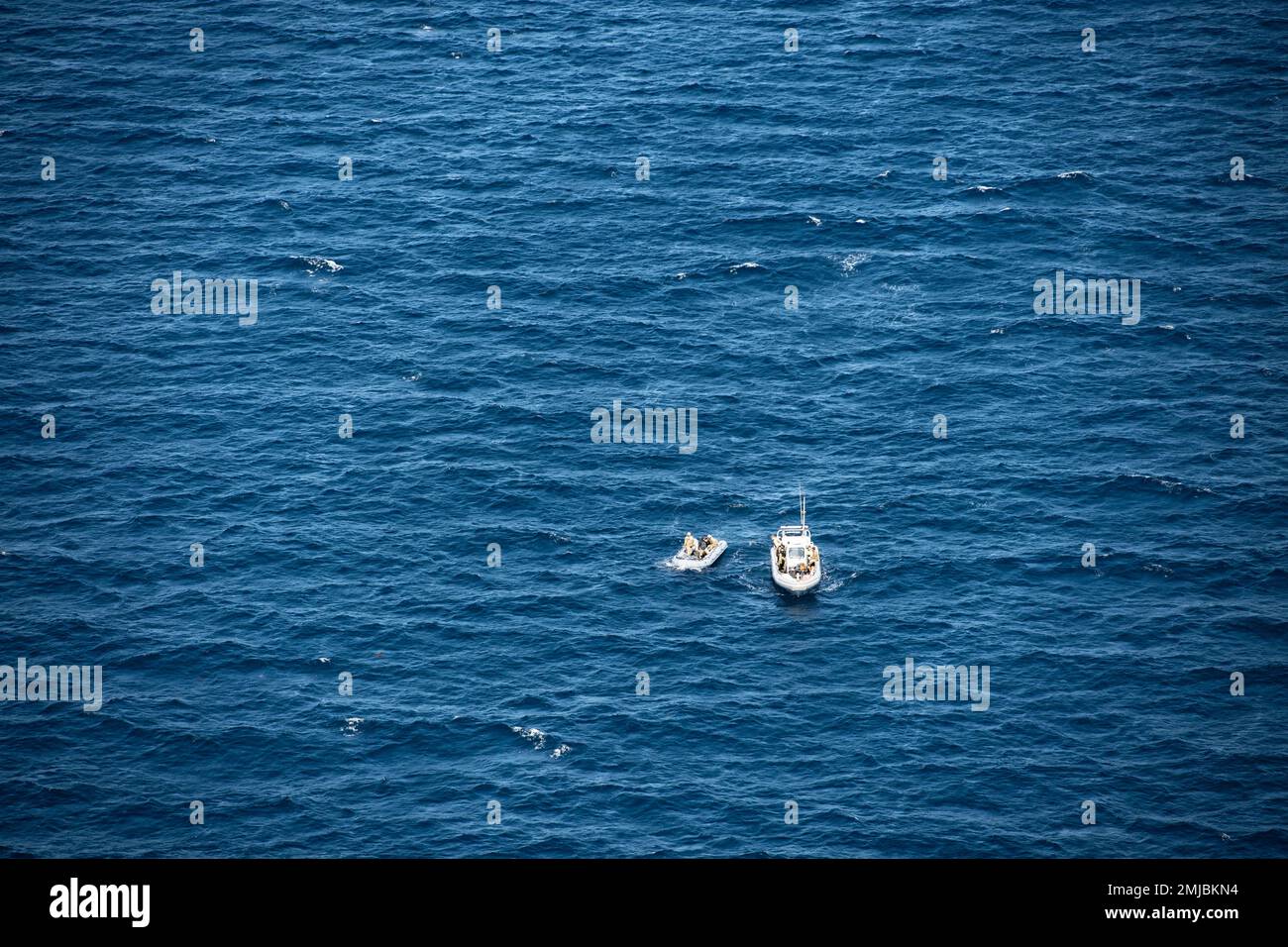 A rigid-hull inflatable boat (RHIB) attached to Explosive Ordnance ...