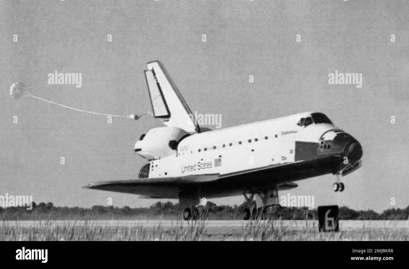 The Space Shuttle Endeavour deploys a parachute to help slow down after ...