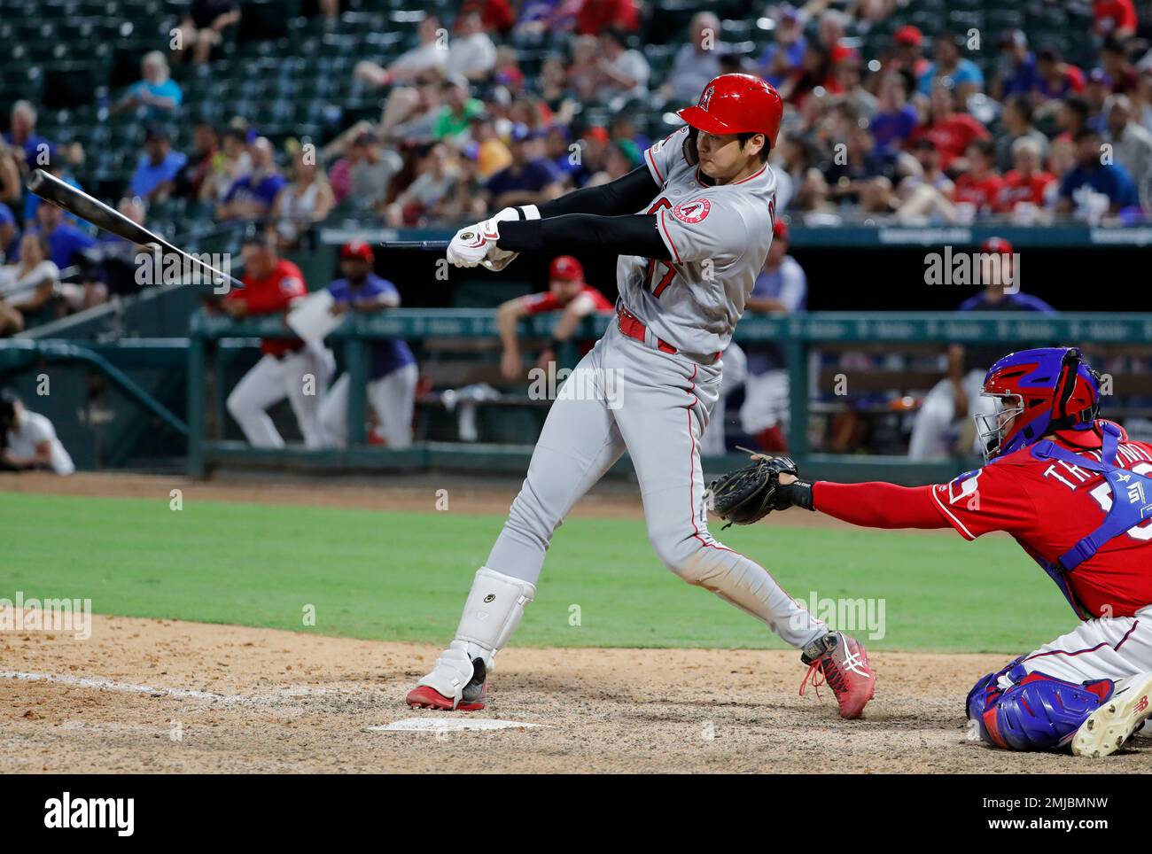 Los Angeles Angels' Shohei Ohtani breaks his bat hitting into a double ...