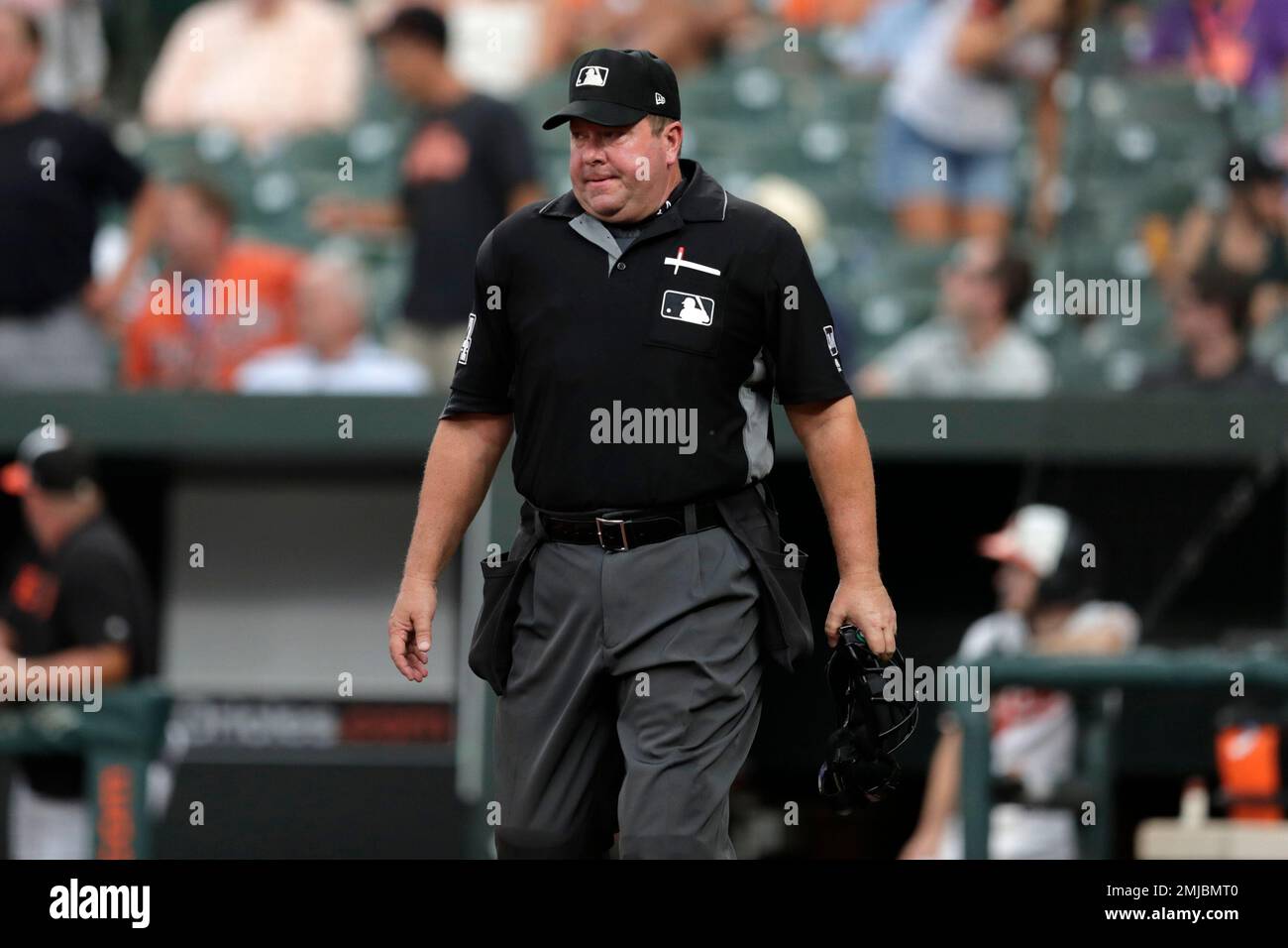 Home plate umpire Sam Holbrook looks on during the second inning of a ...