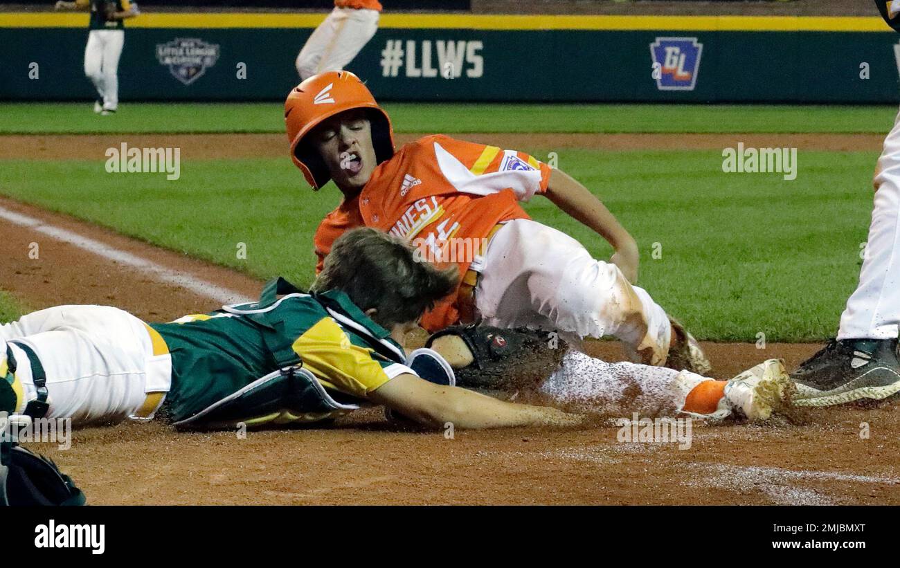 River Ridge, Louisiana's Gavin Berry (15) scores before Coon Rapids ...