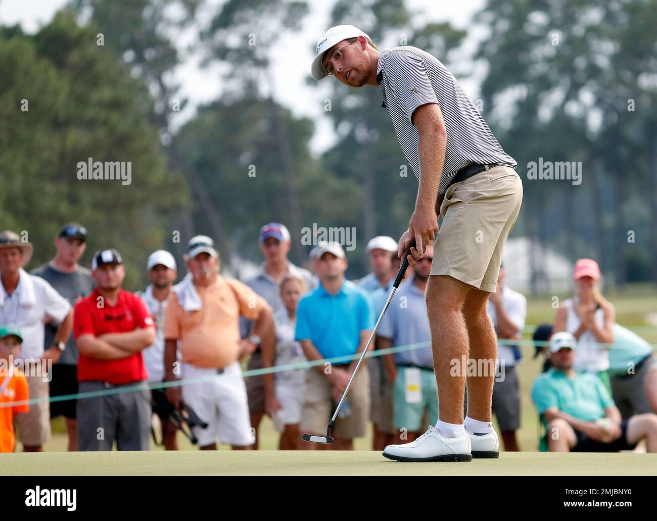 Andy Ogletree watches his putt during the final match against John ...