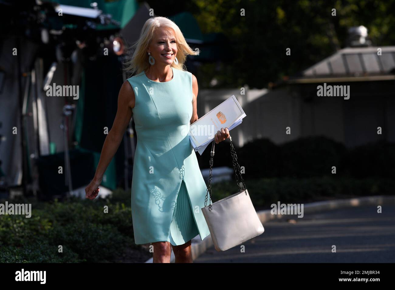 White House counselor Kellyanne Conway walks over to talk with ...