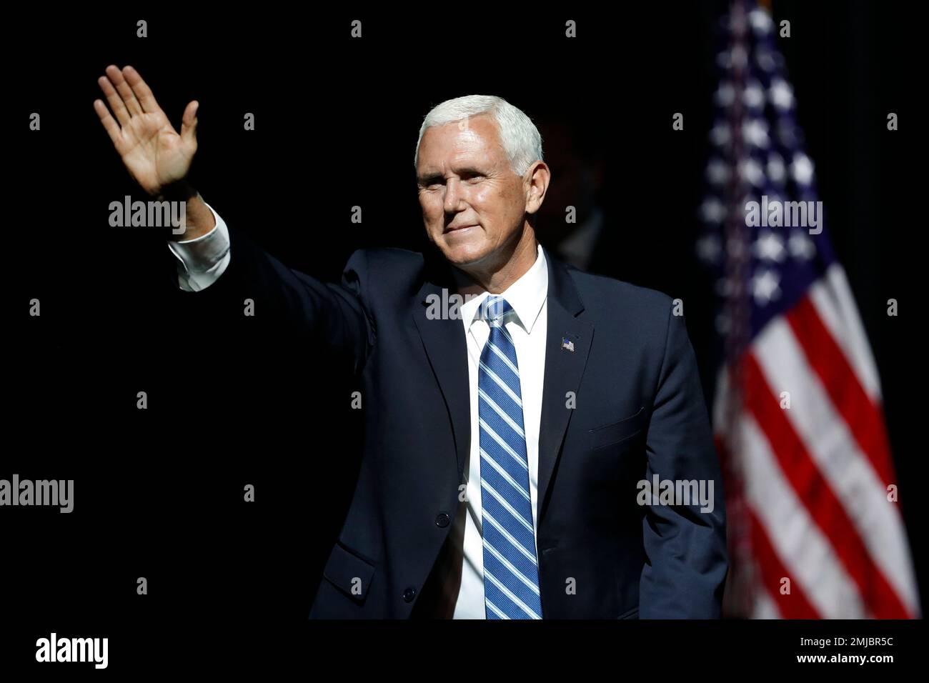 Vice President Mike Pence waves to the audience at the Economic Club of ...