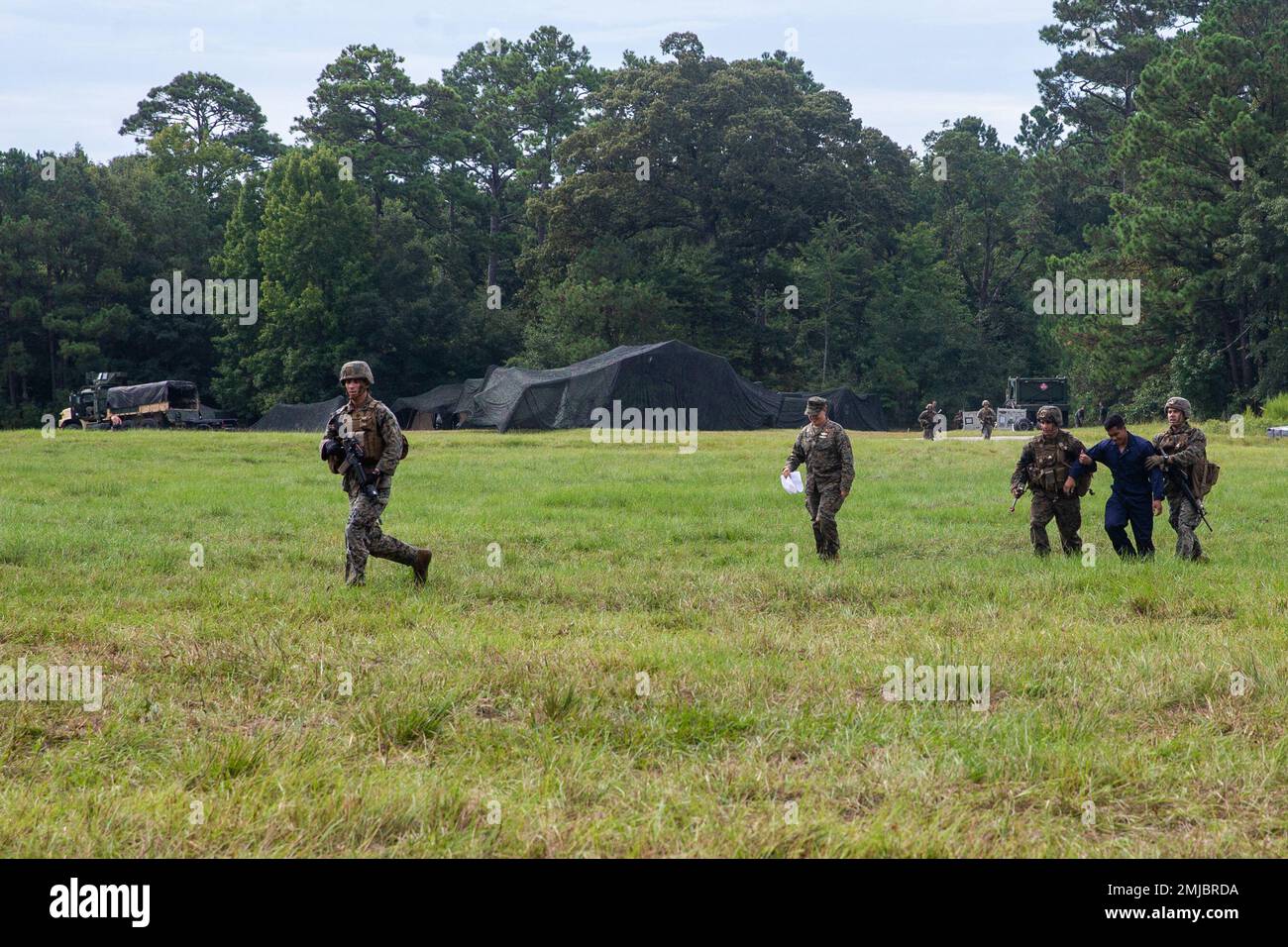 U.S. Marines and U.S. Navy hospital corpsmen with Combat Logistics ...