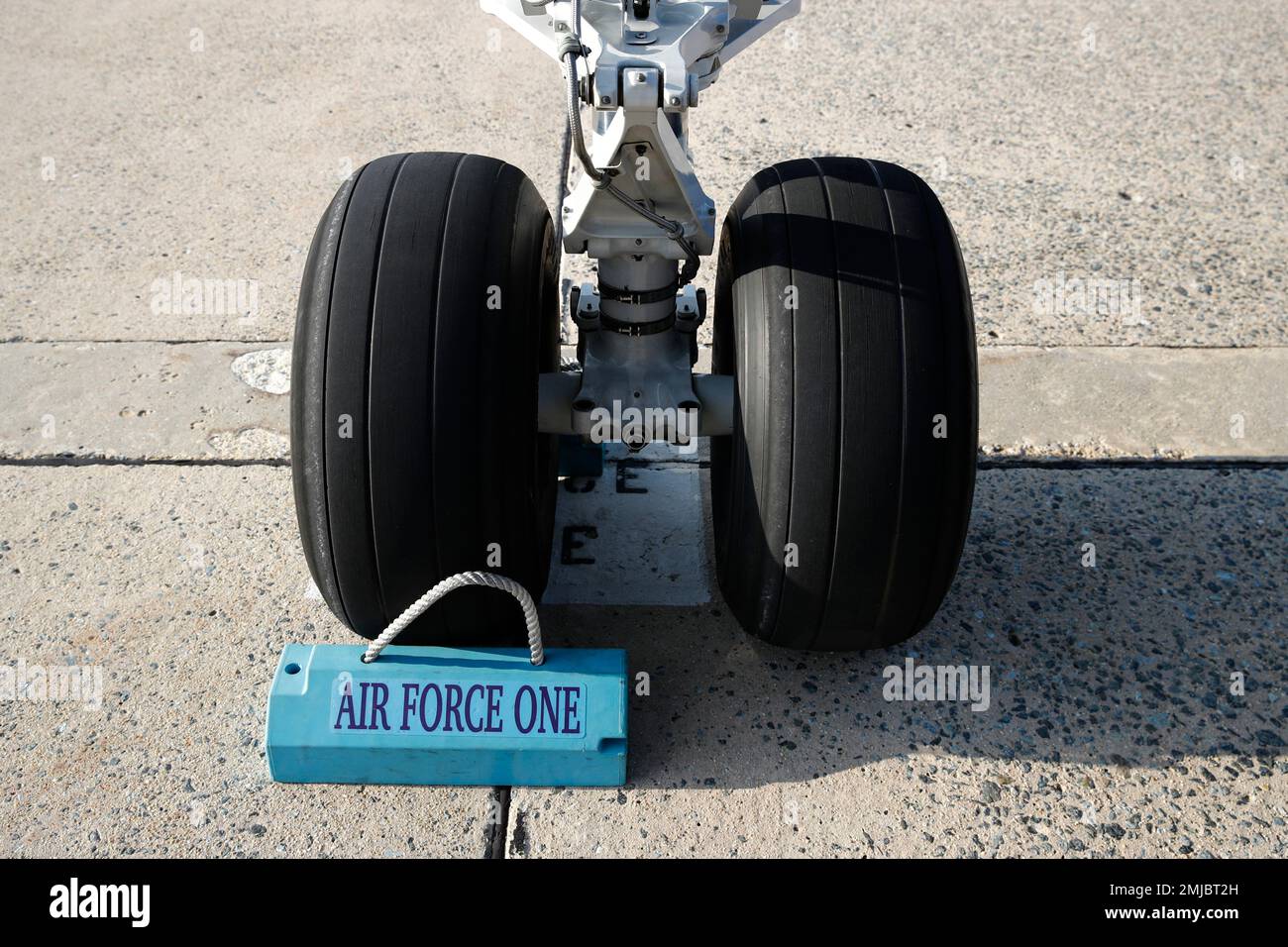 A wheel chock rests against Air Force One's landing gear at Andrews Air ...