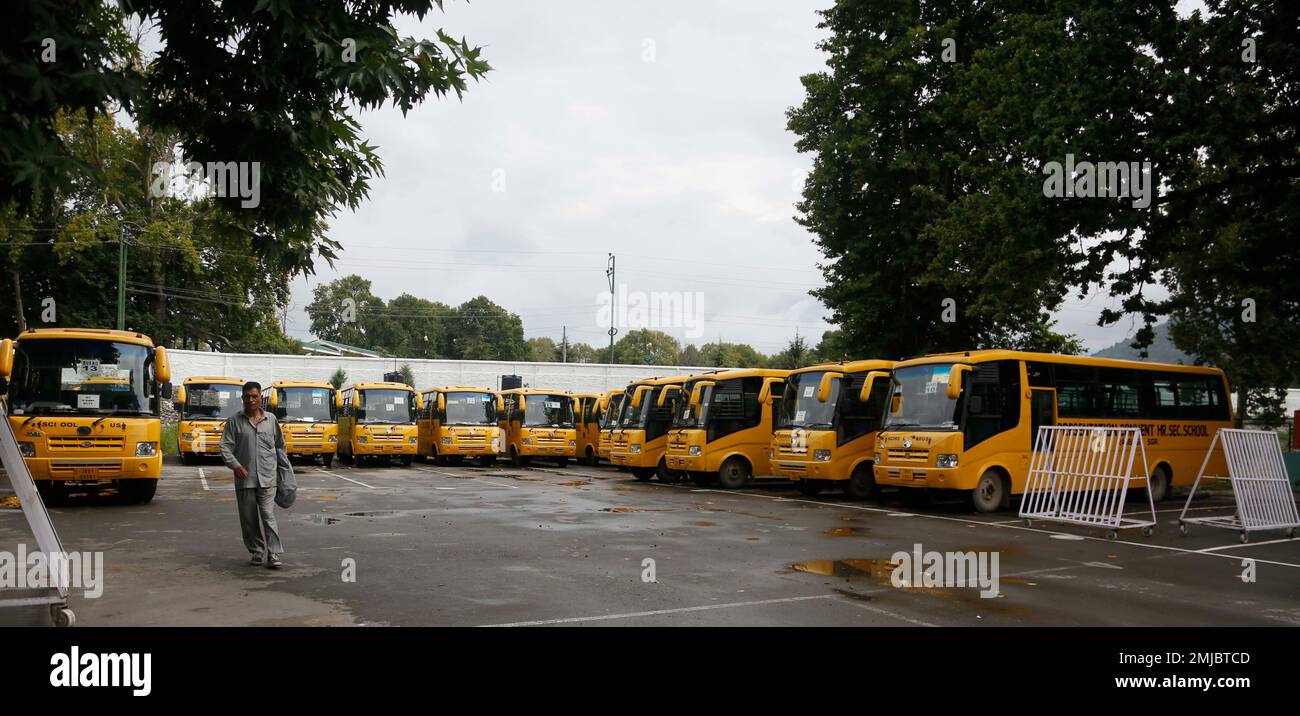 School buses are parked inside the premises of a deserted school ...