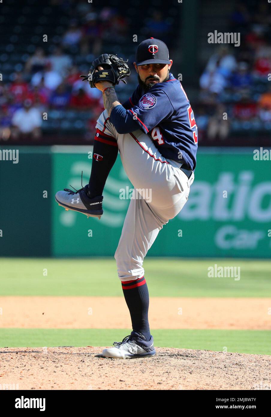Minnesota Twins relief pitcher Sergio Romo (54) works against the Texas ...
