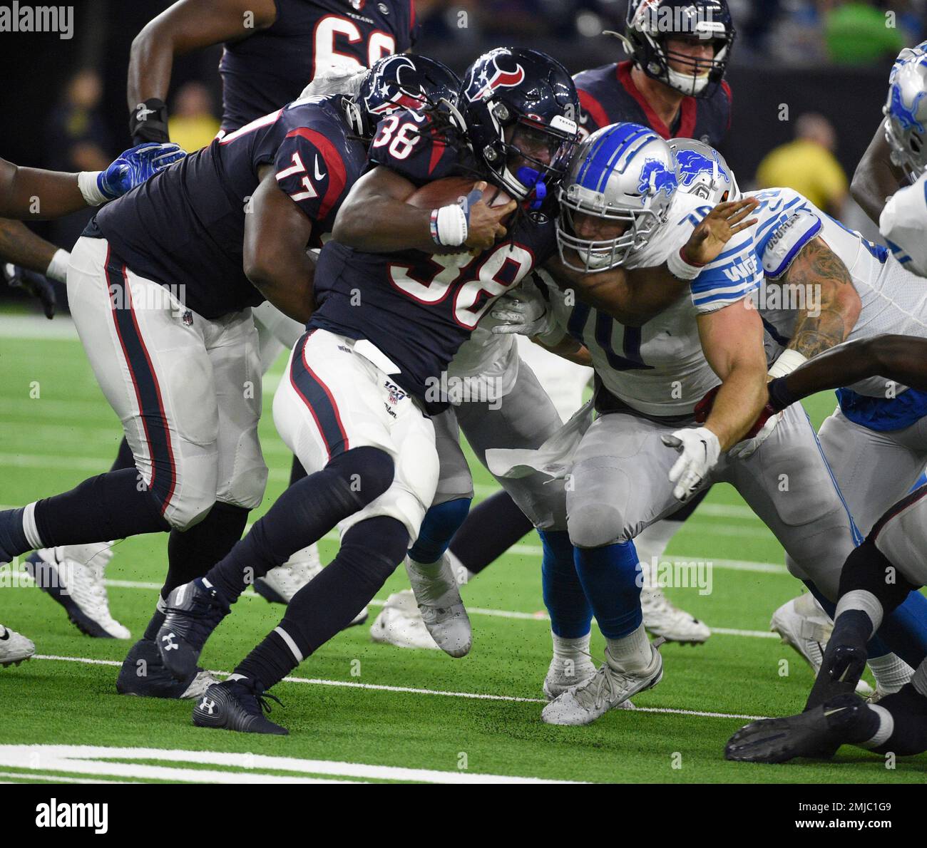 Detroit Lions defensive end Mitchell Loewen (70) tackles Houston Texans ...