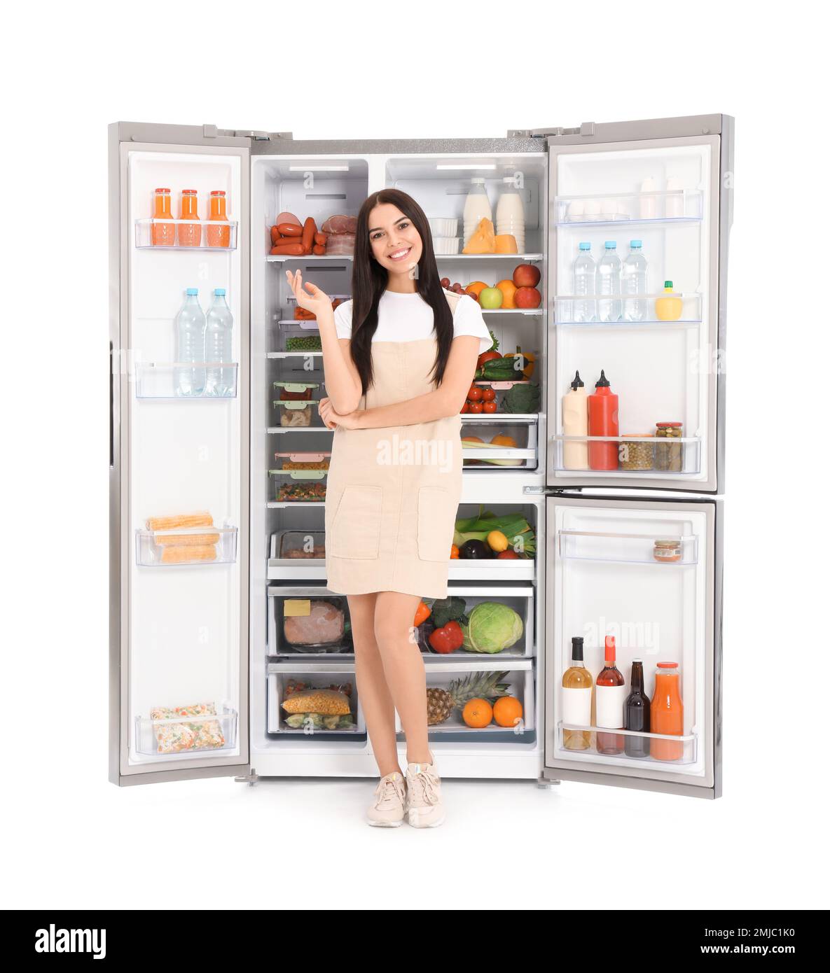 Young woman on fridge Cut Out Stock Images & Pictures - Alamy