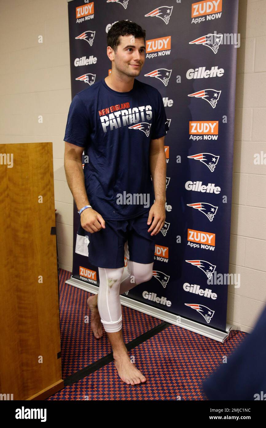 New England Patriots quarterback Jarrett Stidham leaves a news ...