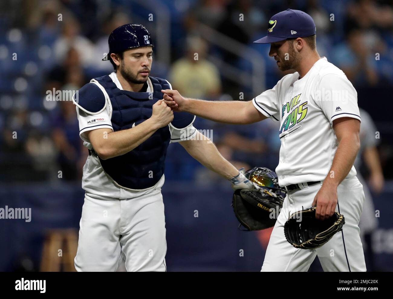 Tampa Bay Rays catcher Travis d'Arnaud, left, congratulates relief ...
