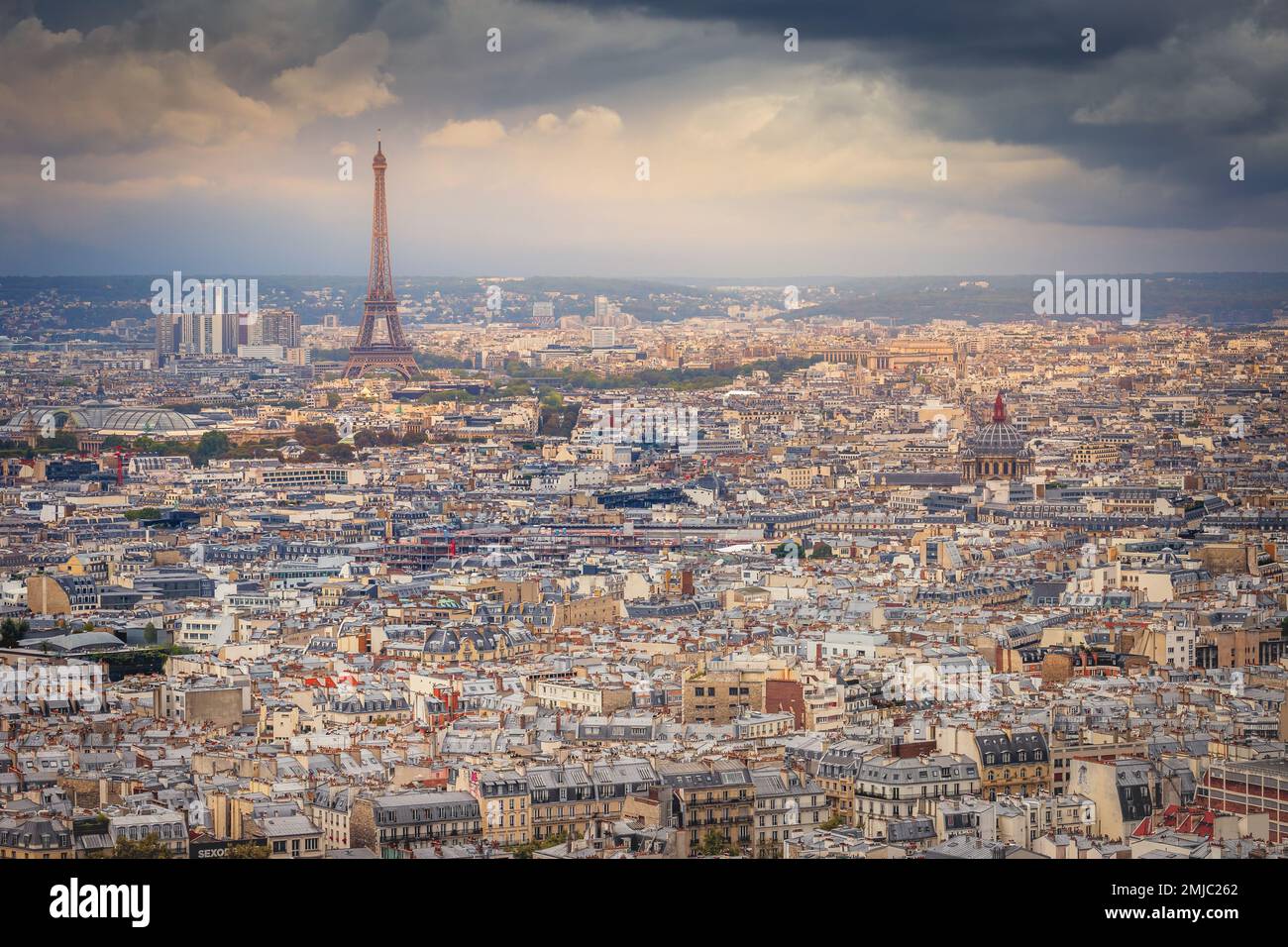 Paris skyline at sunset with Eiffel Tower above parisien roofs, Paris ...